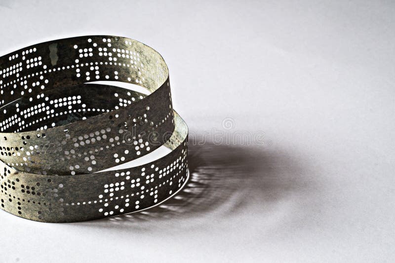 Strips of Old Punched Tape on a White Surface Stock Photo - Image of ...