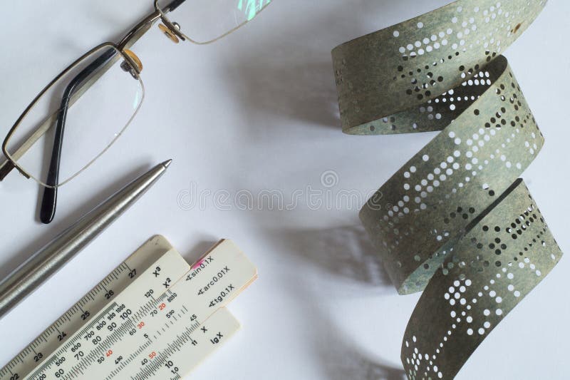 Strips of Old Punched Tape on a White Surface Stock Photo - Image of ...