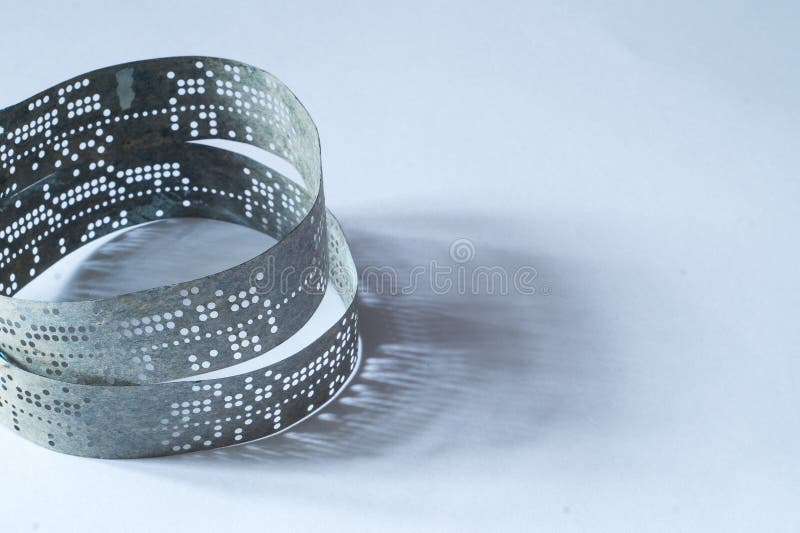 Strips of Old Punched Tape on a White Surface Stock Image - Image of ...