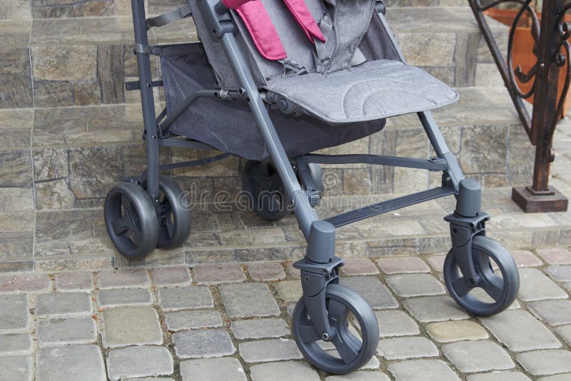 Stroller Under the Stairs,gray Stroller Stands Near the House Under the ...