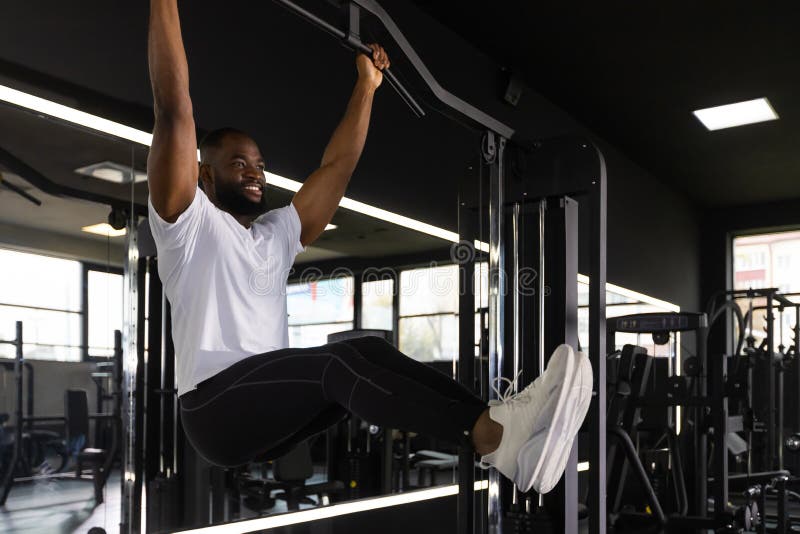 Strong African Man Doing Statics Exercise on Horizontal Bar, Having ...