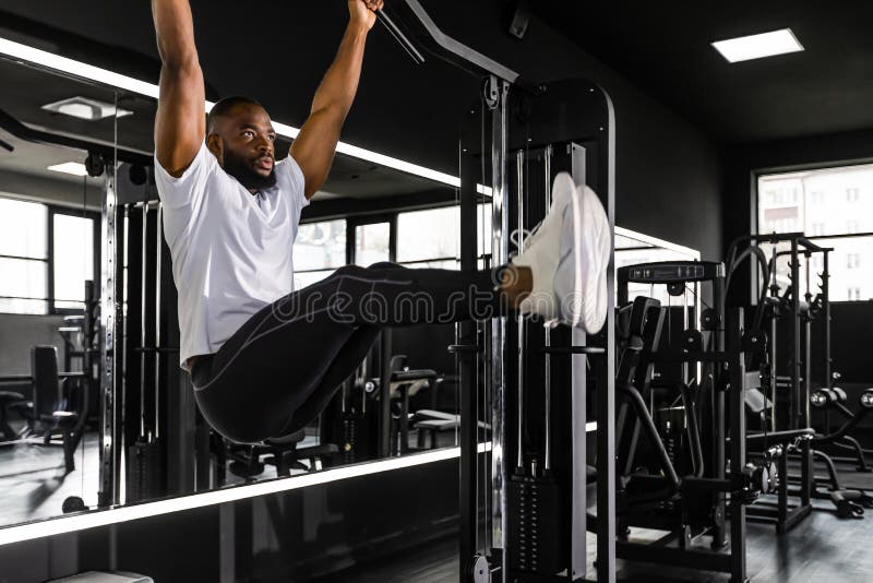 Strong African Man Doing Statics Exercise on Horizontal Bar, Having ...