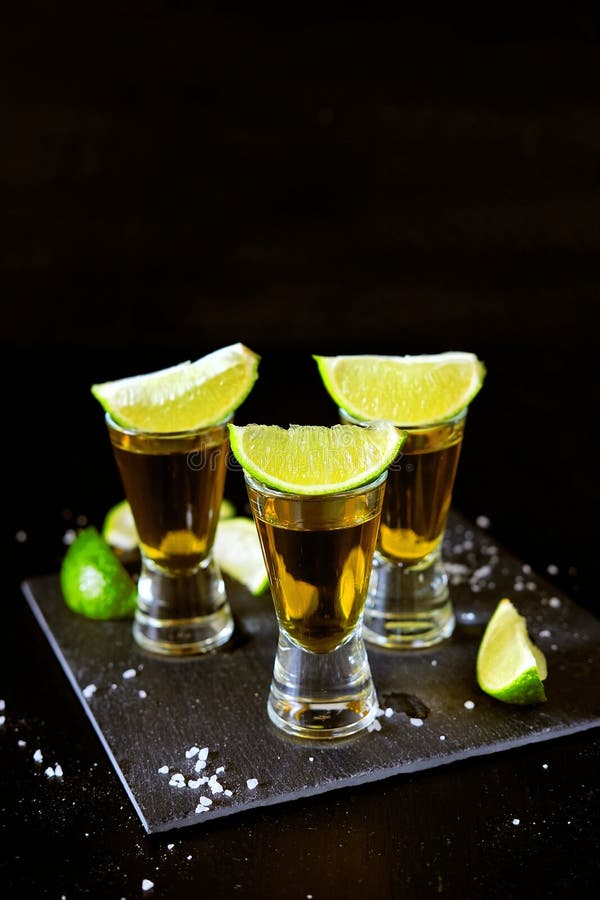 Strong Alcohol Drinks. Tequila Shots with Salt and Lime Slices. Stock ...