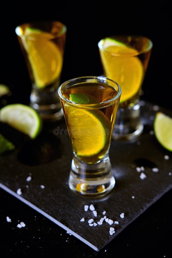 Strong Alcohol Drinks. Tequila Shots with Salt and Lime Slices. Stock ...