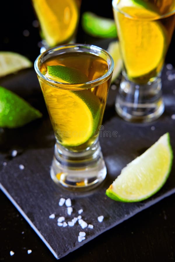 Strong Alcohol Drinks. Tequila Shots with Salt and Lime Slices. Stock ...