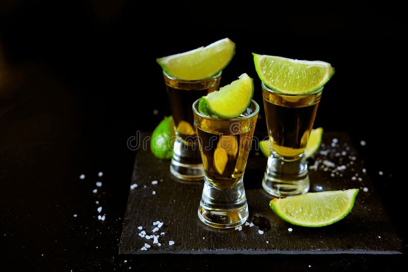 Strong Alcohol Drinks. Tequila Shots with Salt and Lime Slices. Stock ...