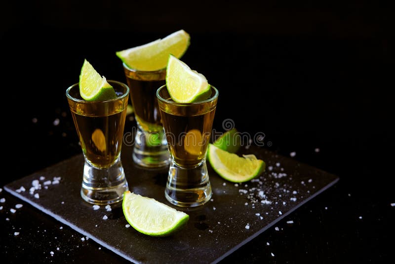 Strong Alcohol Drinks. Tequila Shots with Salt and Lime Slices. Stock ...