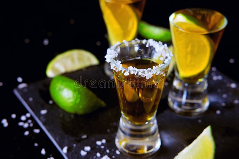 Strong Alcohol Drinks. Tequila Shots with Salt and Lime Slices. Stock ...