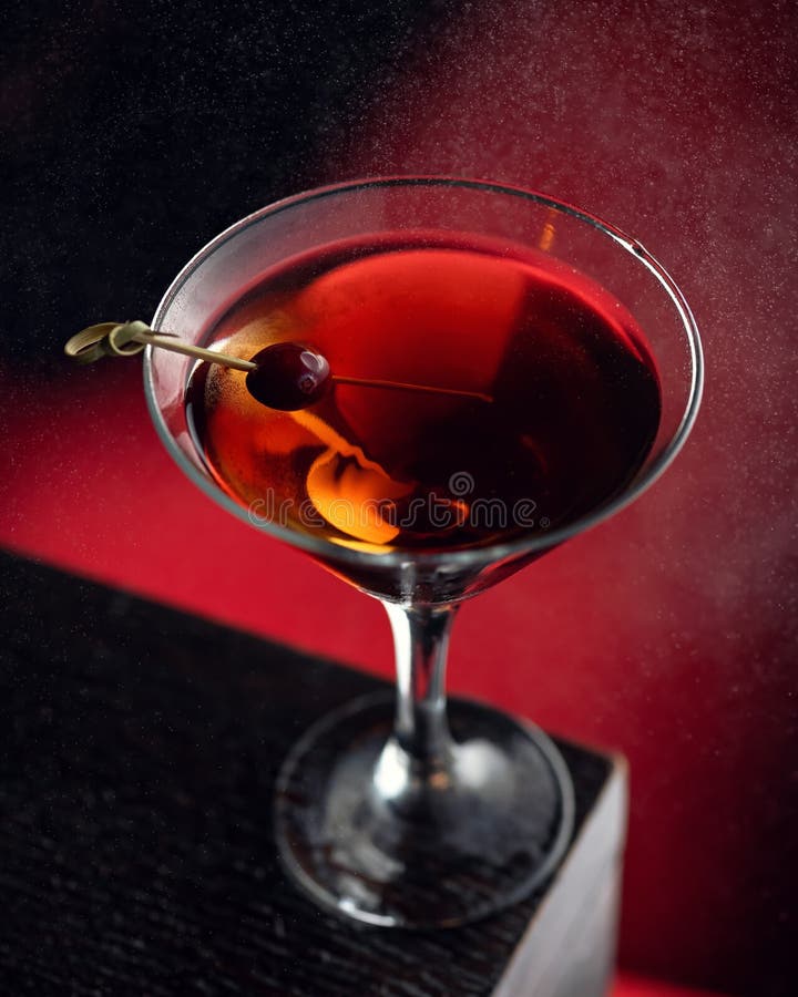 Strong Alcoholic Cocktail or Drink with Cherry, Backlit on Dark Red ...