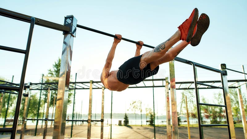 Strong Athlete Doing Statics Exercise on Horizontal Bar Stock Image ...