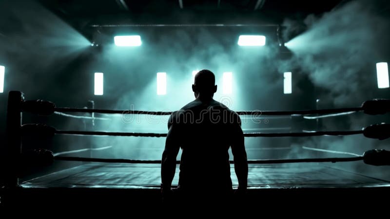 Strong Athlete in Front of a Boxing Ring Under Dramatic Lighting Stock ...