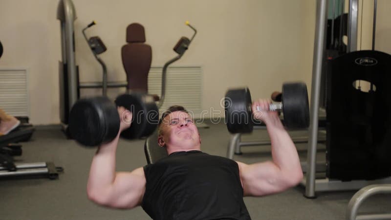 Strong Athlete Performs Bench Press Dumbbell. Stock Video - Video of ...