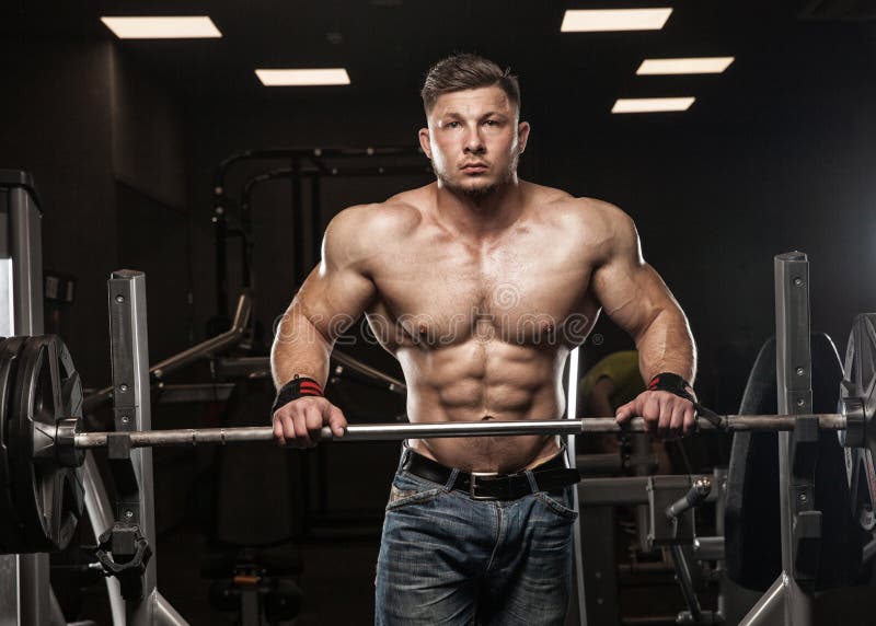 Strong Athletic Man Bodybuilderl Torso Showing Muscles in Gym Stock ...