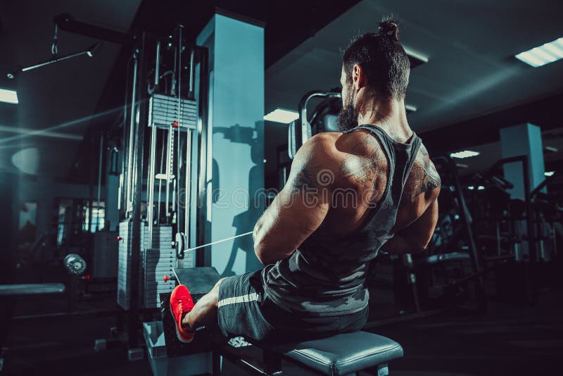 Strong Bodybuilder Doing Heavy Weight Exercise for Back on Machine ...