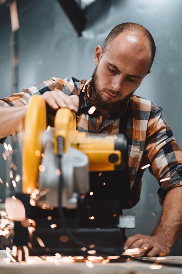 Strong Mechanic Working on Electrical Angular Grinding Machine at ...