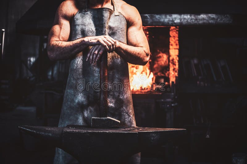 Muscular Man Blacksmith With Hammer In Forge Creating Steel Knife Stock ...