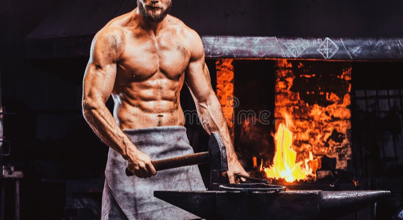 Strong Blacksmith is Posing for Photographer at His Workshop Stock ...