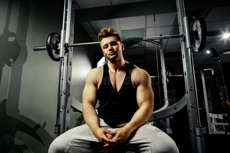 Tired Bodybuilder Athlete with Protein Shaker and Towel in Gym Stock ...