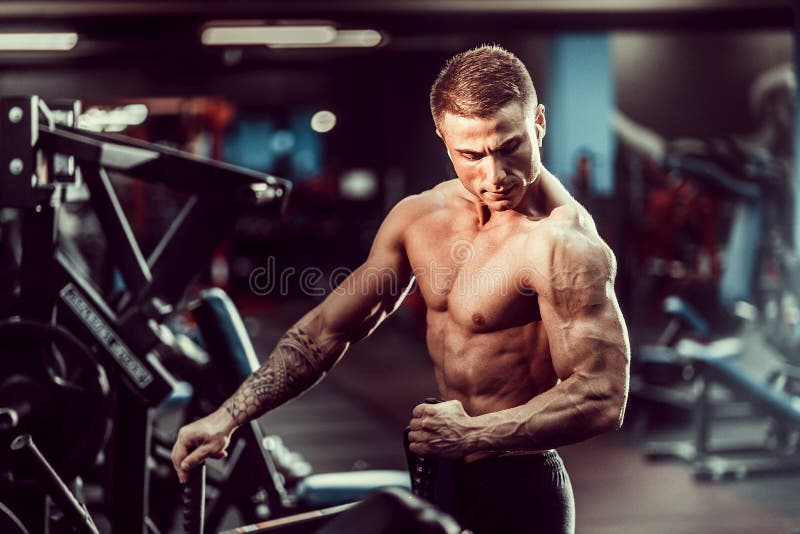 Strong Bodybuilder Doing Heavy Weight Exercise for Back on Machine ...