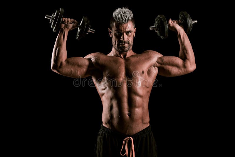Handsome Young Muscle Man with Hand on Rusty Metal Structure Stock ...