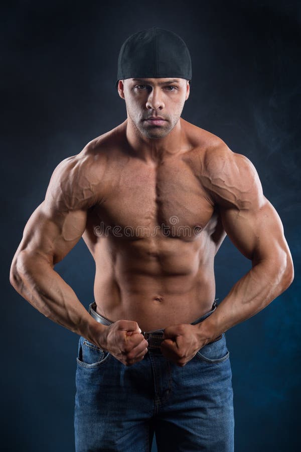 Strong Bodybuilder Strains His Powerful Muscles Stock Photo - Image of ...