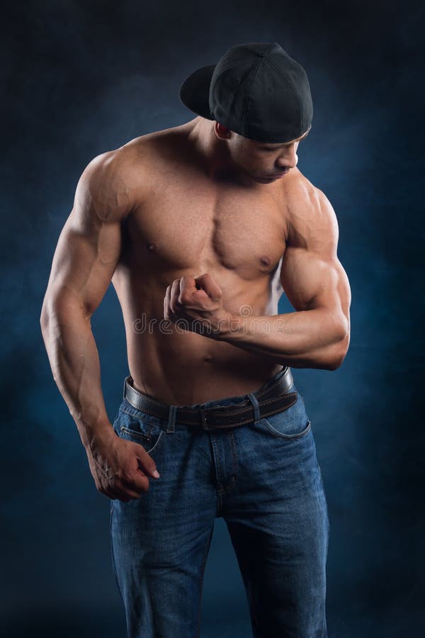 Strong Bodybuilder Strains His Powerful Muscles Stock Photo - Image of ...