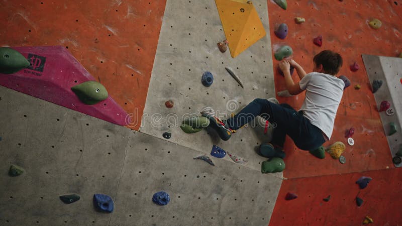A Strong Boy Performs Complex Elements while Training on a Climbing ...