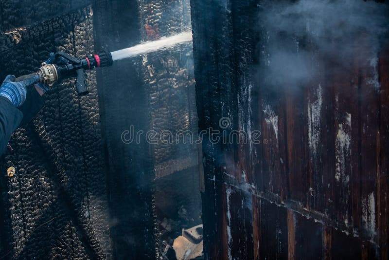 Strong Brave Firefighter Using Extinguisher and Water from Hose for ...