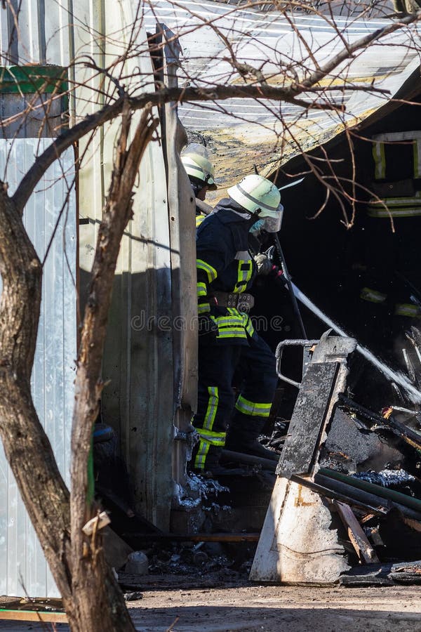 A Strong and Brave Fireman Rescues a Burning Building Using Water in a ...