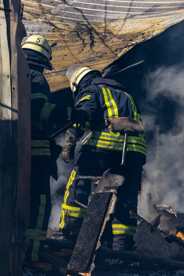 A Strong and Brave Fireman Rescues a Burning Building Using Water in a ...