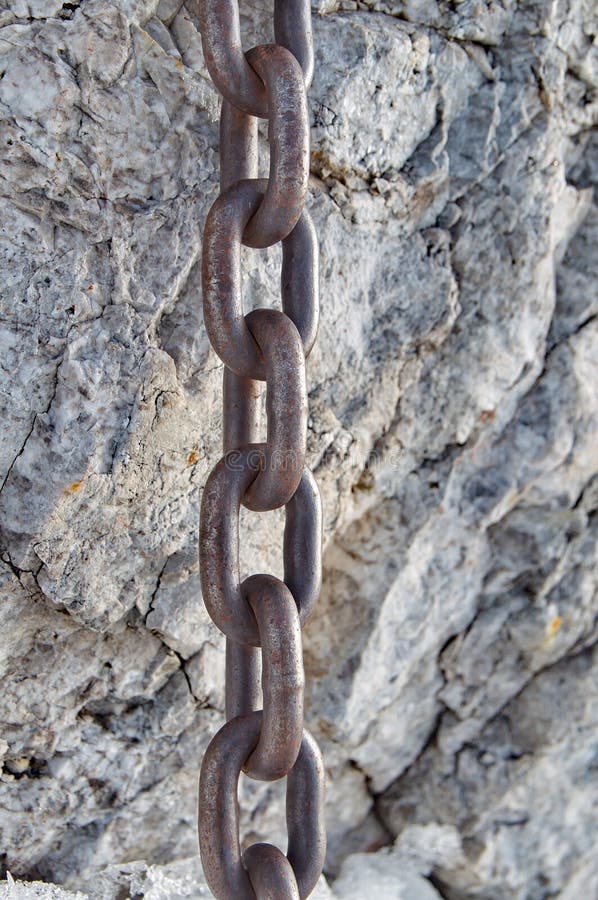 Strong chain on rock stock image. Image of secure, link - 45947743
