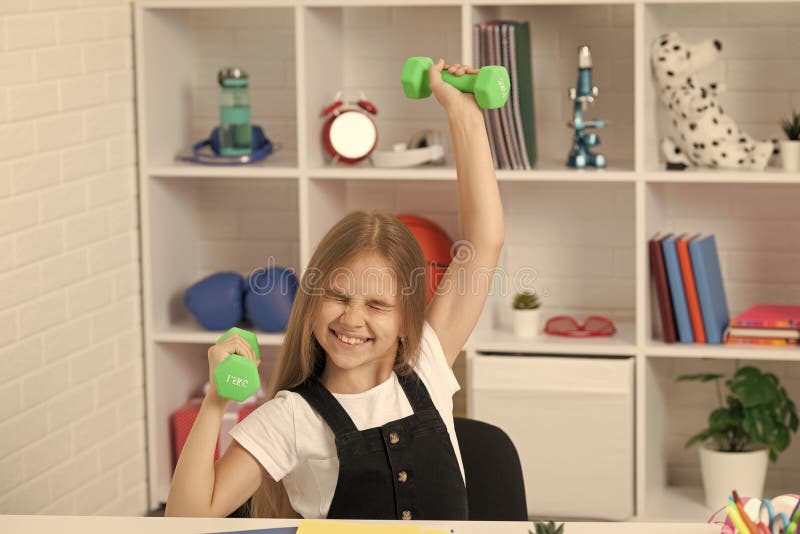 Strong Child Hold Barbells in School Classroom Stock Photo - Image of ...