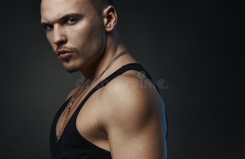 Strong Confident Man in a Black T-shirt Stock Photo - Image of neclace ...