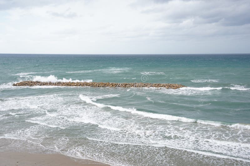 Strong Currents and Waves in the Sea. Waves Successfully Crash into the ...