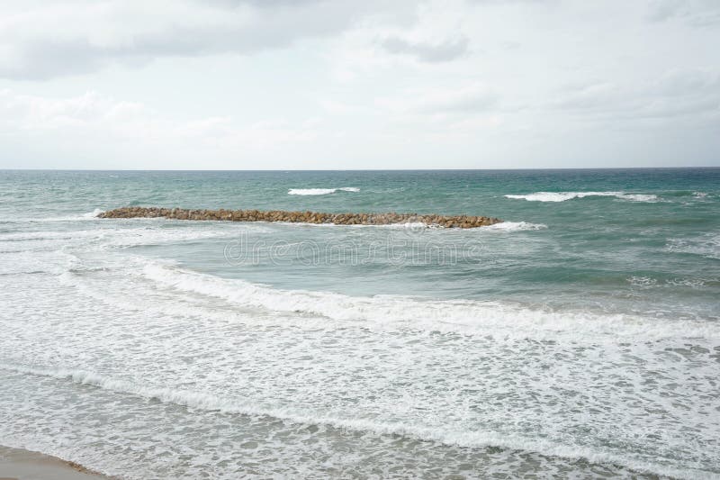 Strong Currents and Waves in the Sea. Waves Successfully Crash into the ...