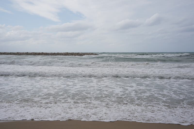 Strong Currents and Waves in the Sea. Waves Successfully Crash into the ...
