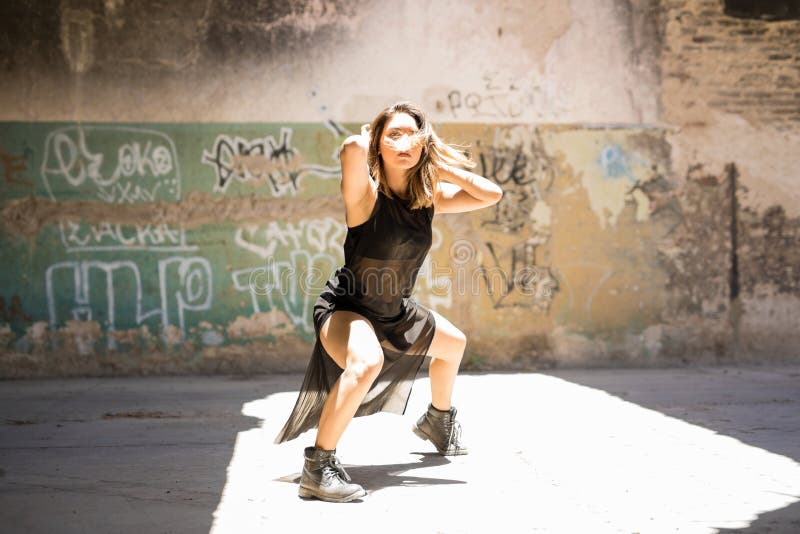 Female Performer Stretching Leg on Railing in the City Stock Photo ...