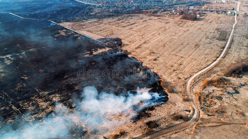Strong Fire in an Empty Field, Slight Smoke from a Burning Place. Large ...