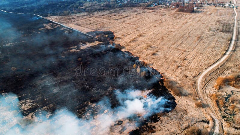 Strong Fire in an Empty Field, Slight Smoke from a Burning Place. Large ...