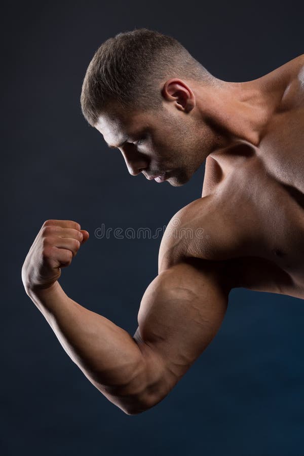 Strong Fit Man Demonstrating His Powerful Muscles Stock Photo - Image ...