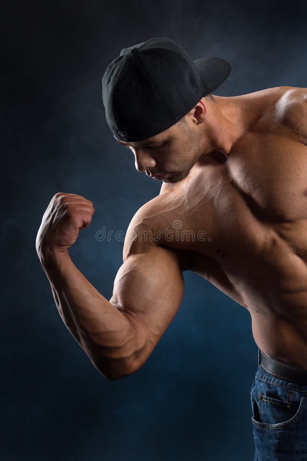 Strong Fit Man Demonstrating His Powerful Muscles Stock Photo - Image ...