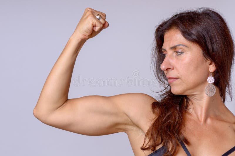 Happy Mature Woman Flexing Bicep Muscles Stock Image Image Of Flexing