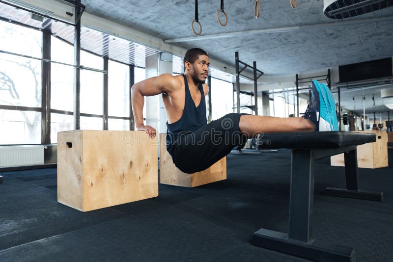 Strong Fitness Man Doing Muscles Exercises in the Gym Stock Photo ...