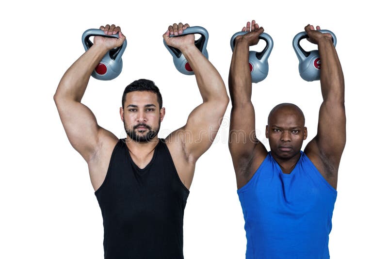 Strong Friends Lifting Kettlebells Together Stock Image - Image of ...