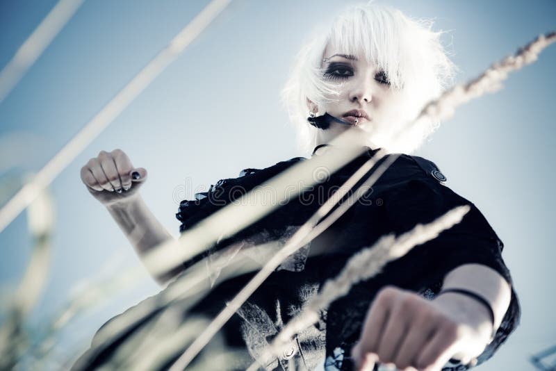 Strong goth woman portrait stock image. Image of hands - 10917781