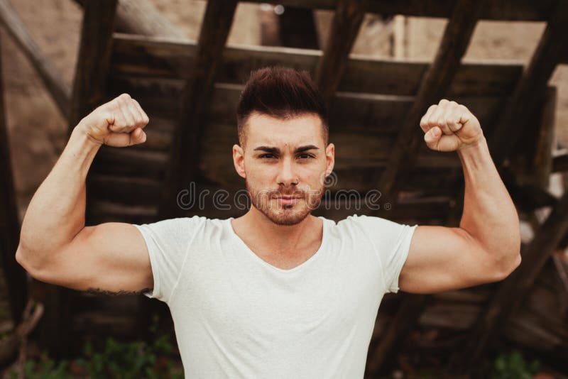 Strong Guy with a Tattoo on His Arm Outside Stock Photo - Image of ...