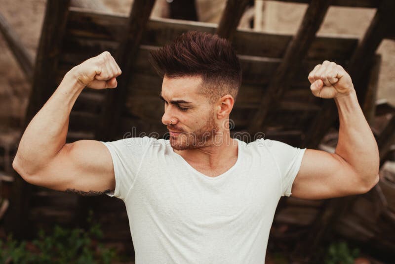 Strong Guy with a Tattoo on His Arm Outside Stock Image - Image of ...