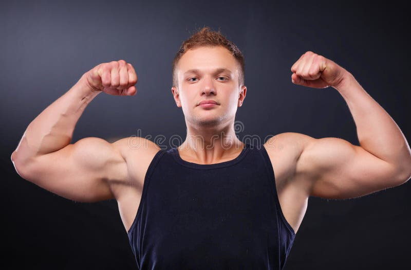 Strong and Handsome Young Bodybuilder Demonstrate His Muscles and ...