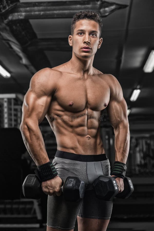 Strong and Handsome Young Man Doing Exercise with Dumbbells Stock Image ...