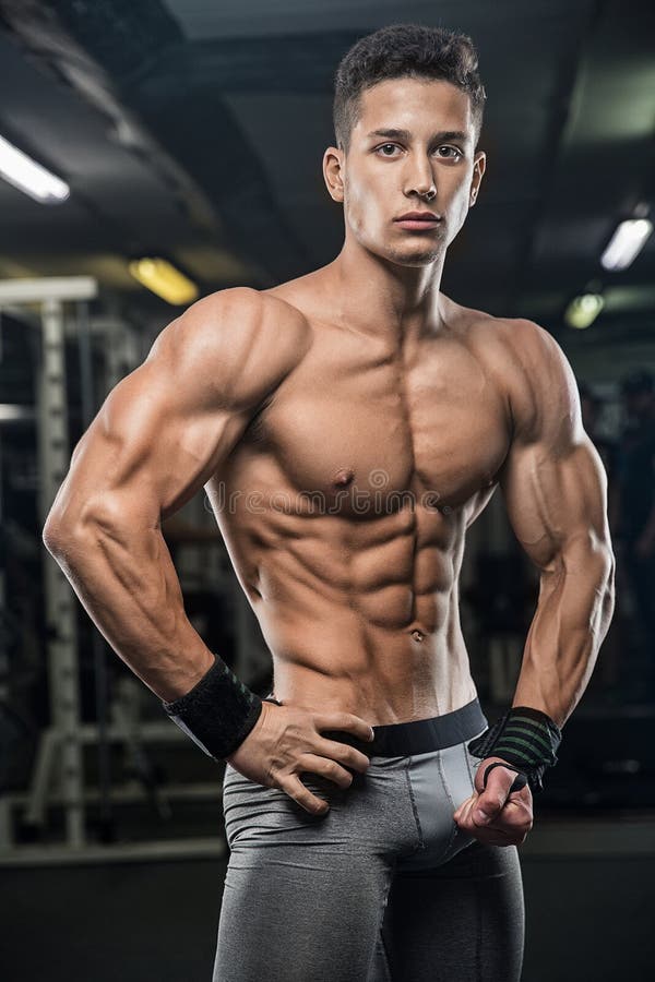 Strong and Handsome Young Man Doing Exercise with Dumbbells Stock Photo ...